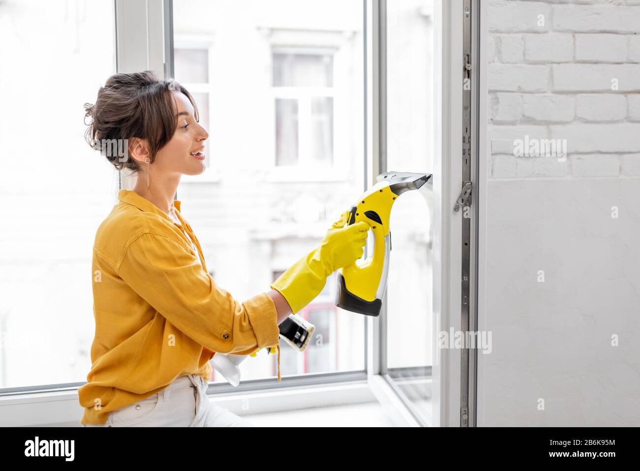 Young Woman Washing Windows High Resolution Stock Photography and ...