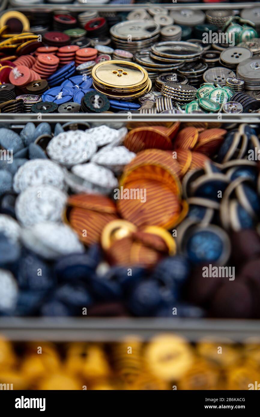 variety of different buttons in boxes with blurry foreground Stock ...