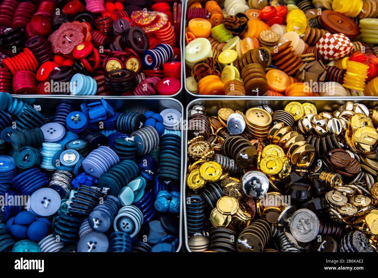 variety of buttons in different colors sorted into boxes Stock Photo ...