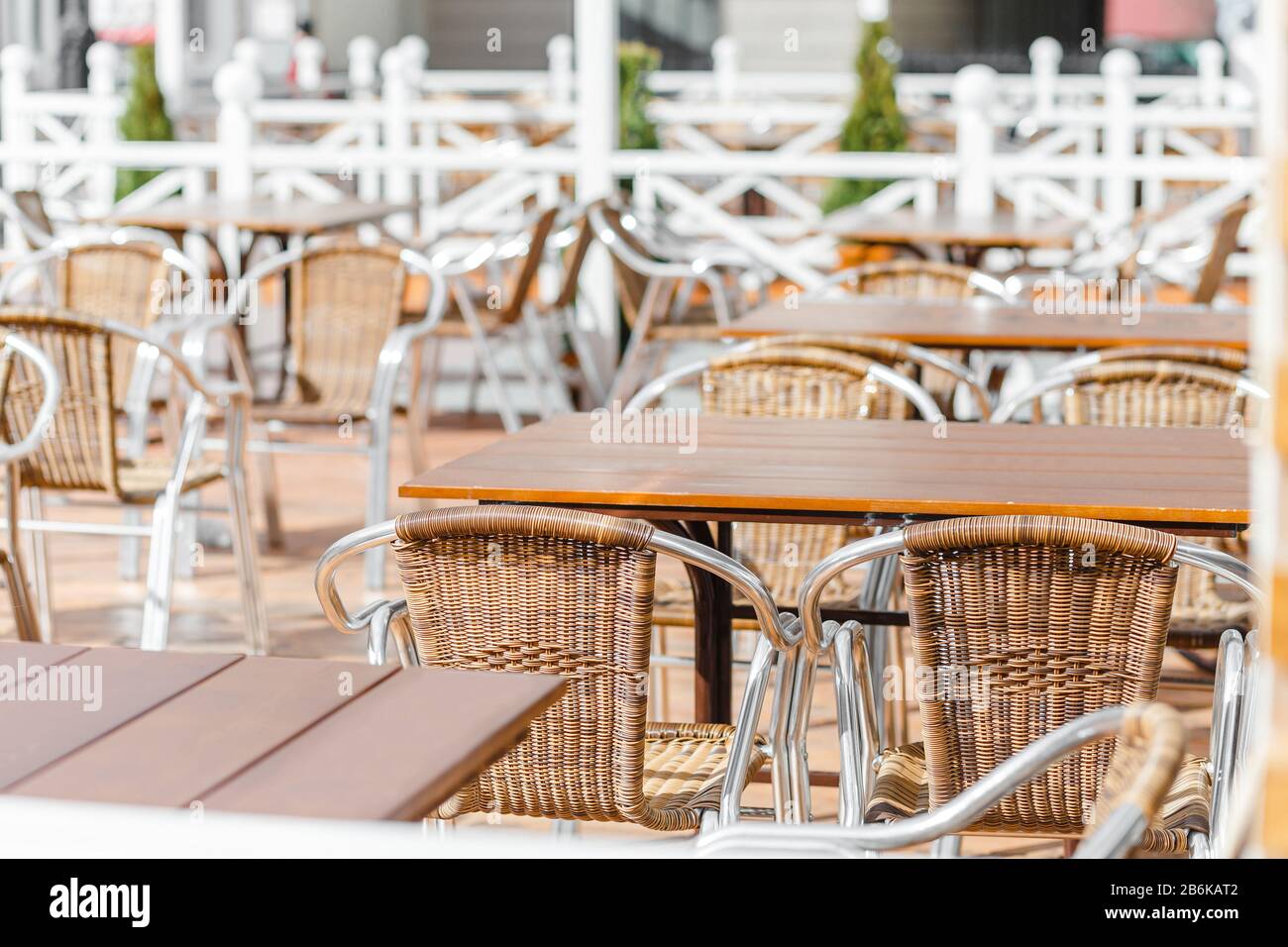 Outdoor empty street cafe tables and seats Stock Photo - Alamy