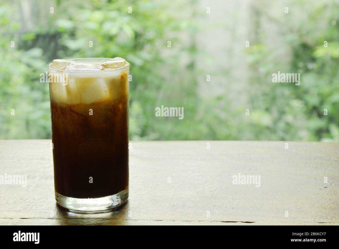 ice coffee topping milk floating in glass Stock Photo - Alamy
