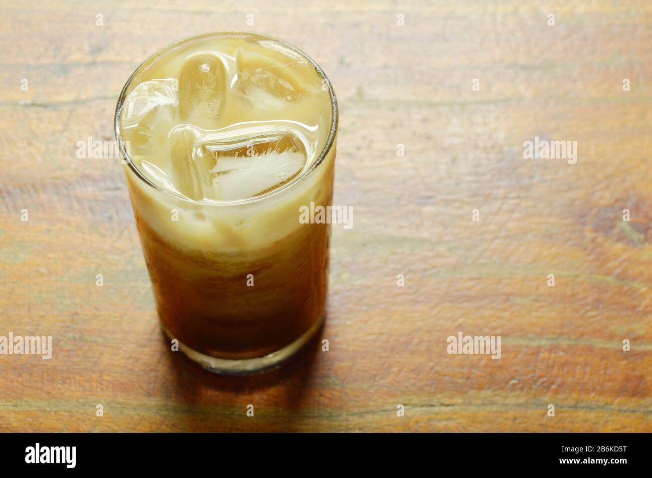 ice coffee topping milk floating in glass Stock Photo - Alamy