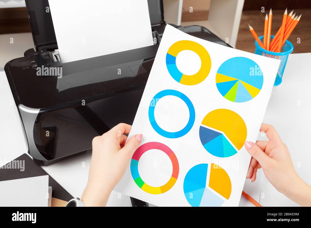 Woman using the printer to scanning and printing document Stock Photo ...