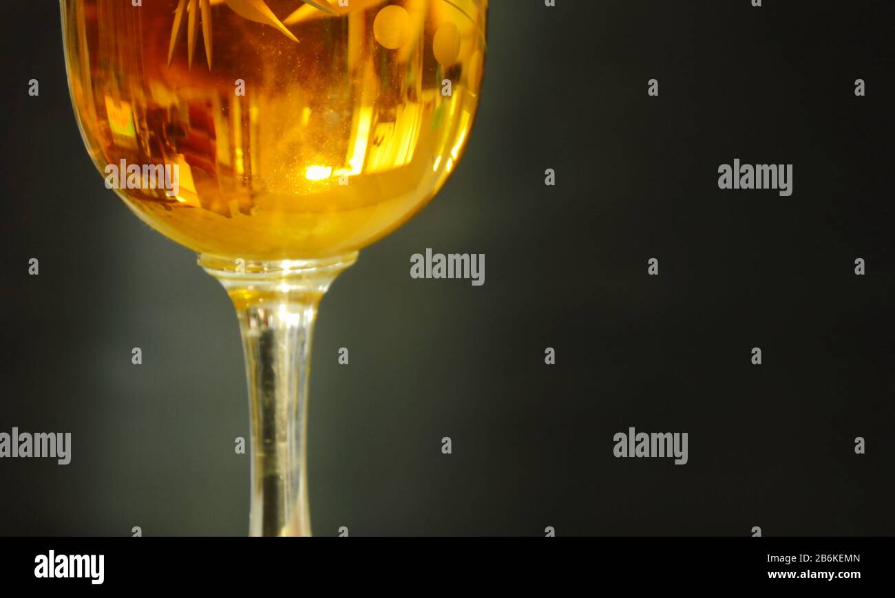 glass of brandy on black background Stock Photo - Alamy