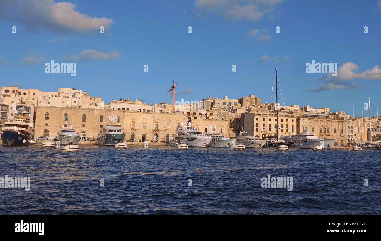Boat trip along the waterfront of Valletta Stock Photo - Alamy