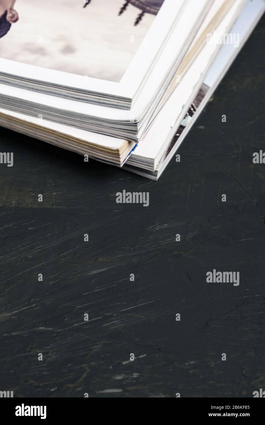 Close up stacking magazine place on table background Stock Photo - Alamy