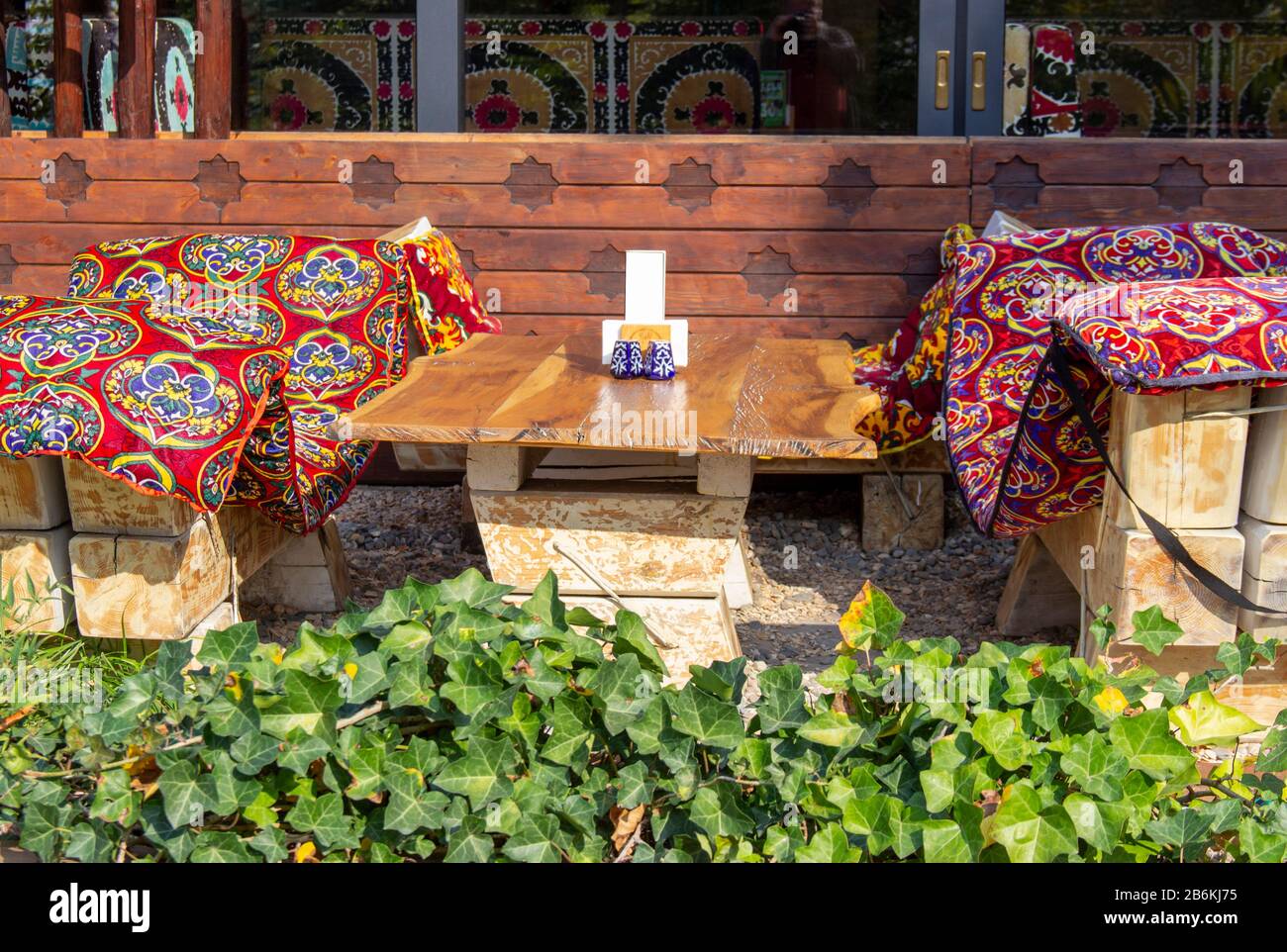 tables and seats in an Asian cafe. furniture in a street restaurant ...