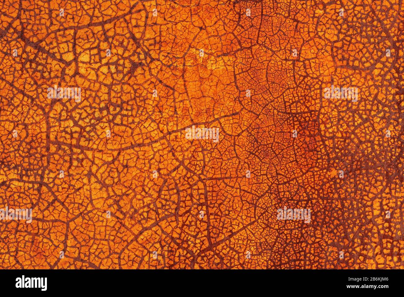 The surface of a rusty sheet of metal with peeling cracked old paint ...