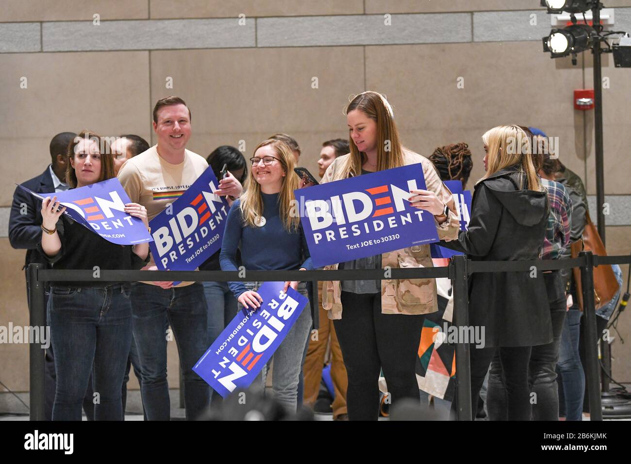 Joe Biden supporters holding political signs wait for the former Vice ...