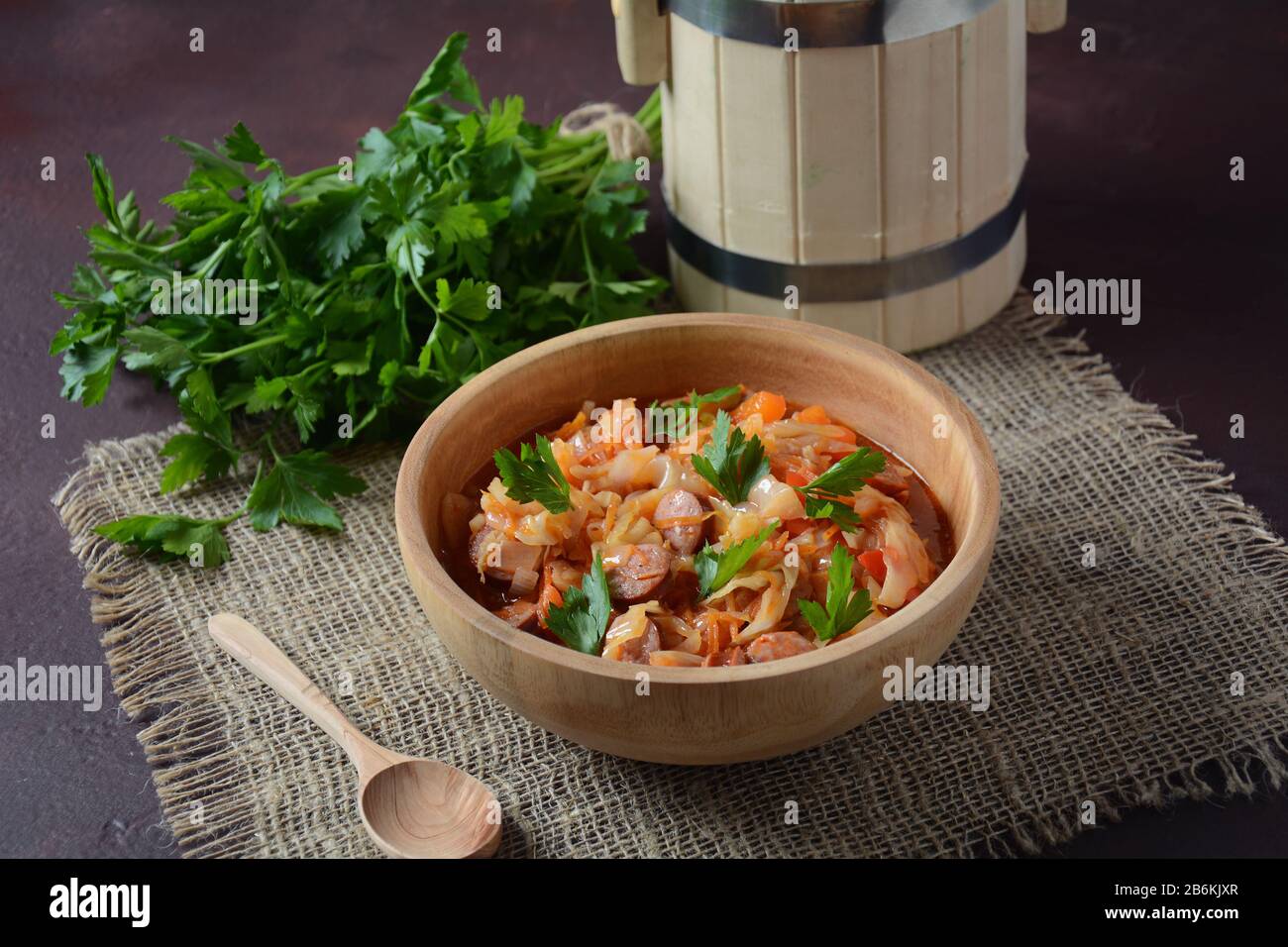 Cabbage stew with grilled sausage in tomato sauce - traditional dish of ...