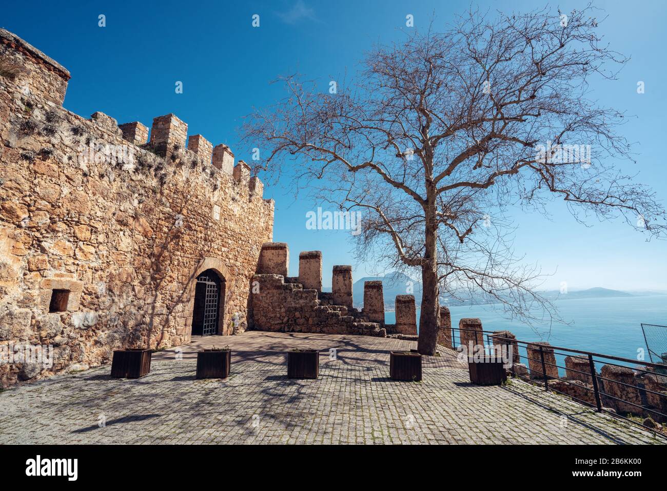 The historical ruins of castle walls next to harbour of city Alanya in ...