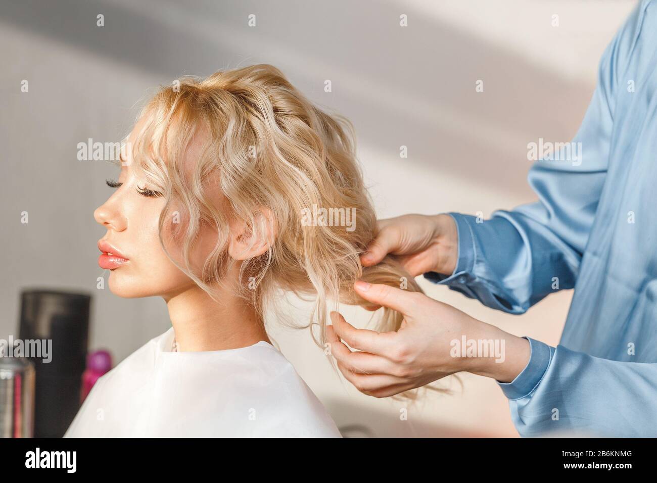 Beautiful girl at hairdresser salon. Making of hairstyle on healthy ...