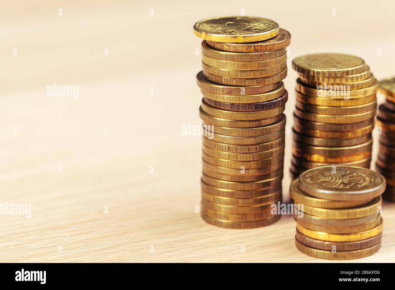 piles of coins on working table creative photo Stock Photo - Alamy