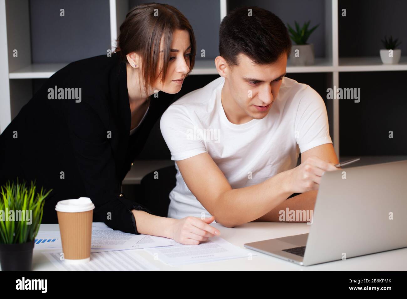 Loving couple working successfully together on their own business Stock ...