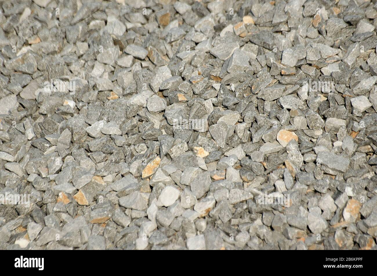 Closeup of crushed limestone gravel. Shallow depth of field. Roadways ...