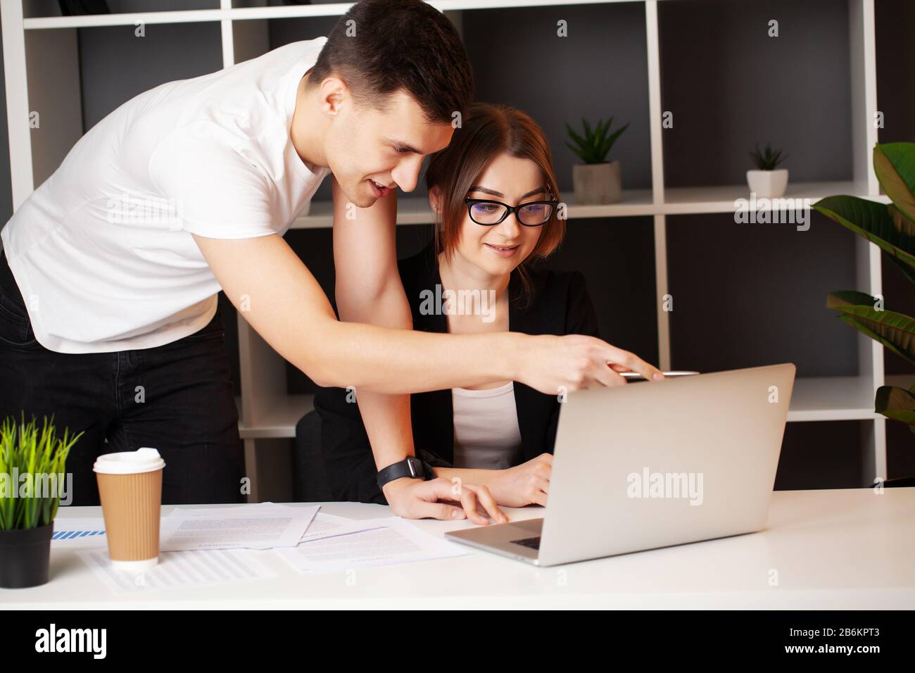 Loving couple working successfully together on their own business Stock ...