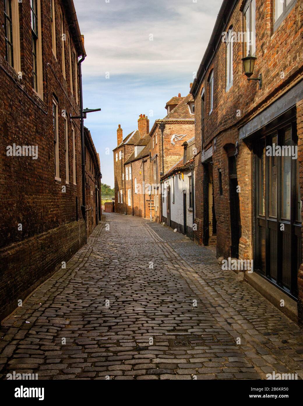 Old historic market street with brick buildings hi-res stock ...