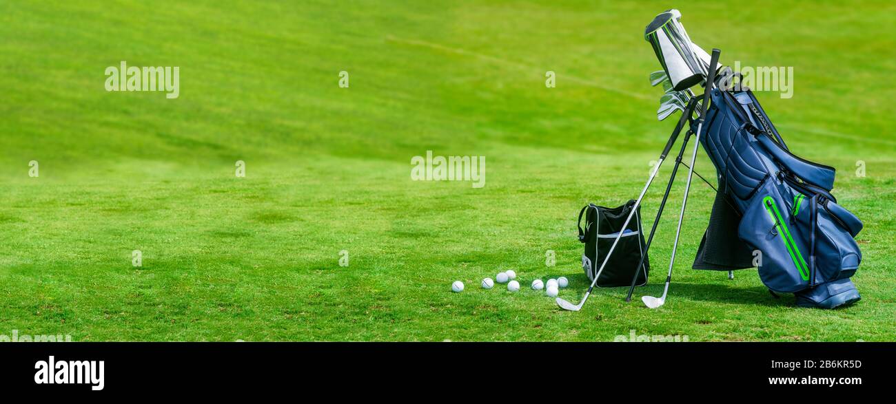 Bag of golf clubs on the golf course banner format Stock Photo - Alamy