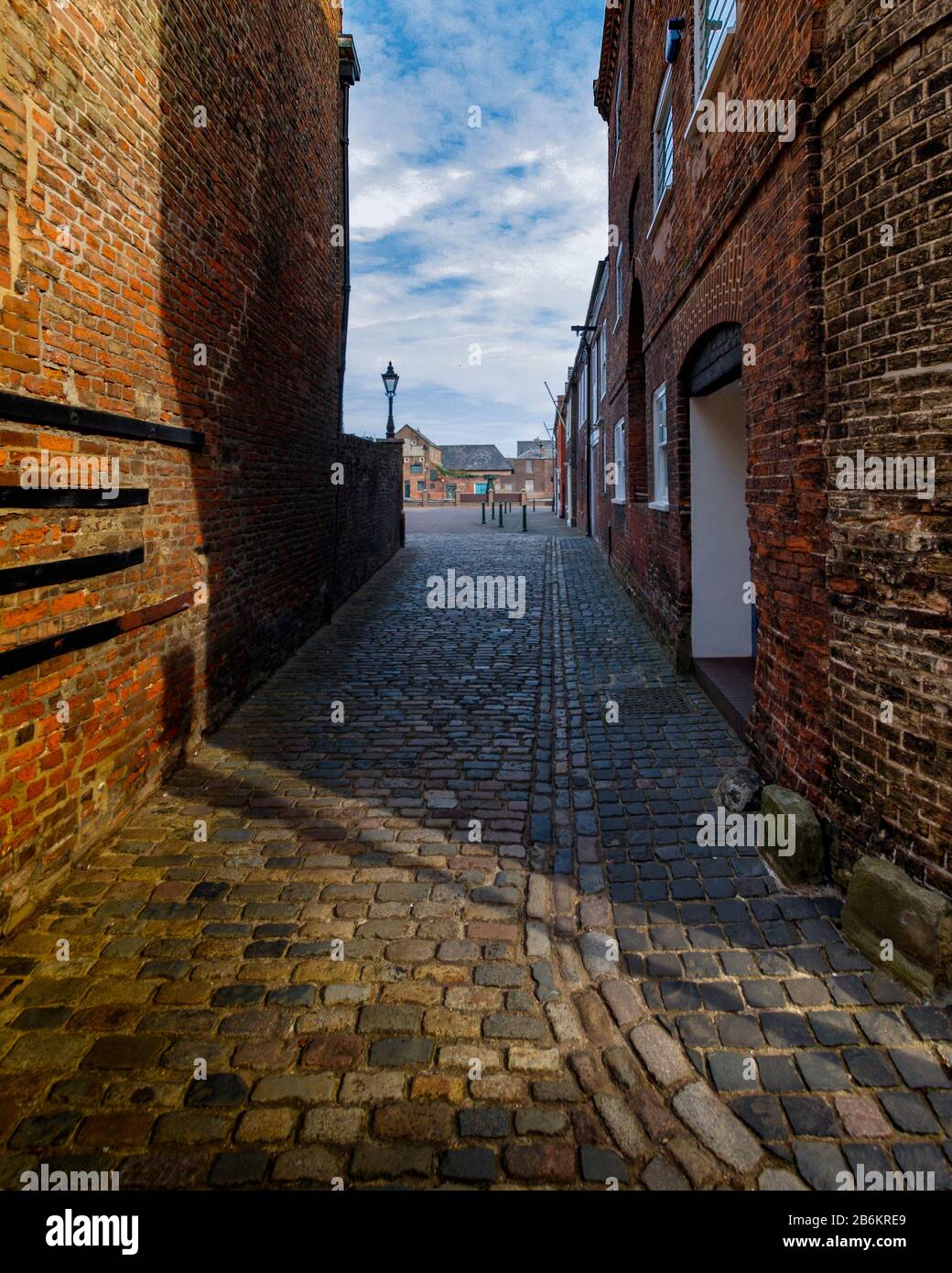 Old historic market street with brick buildings hi-res stock ...