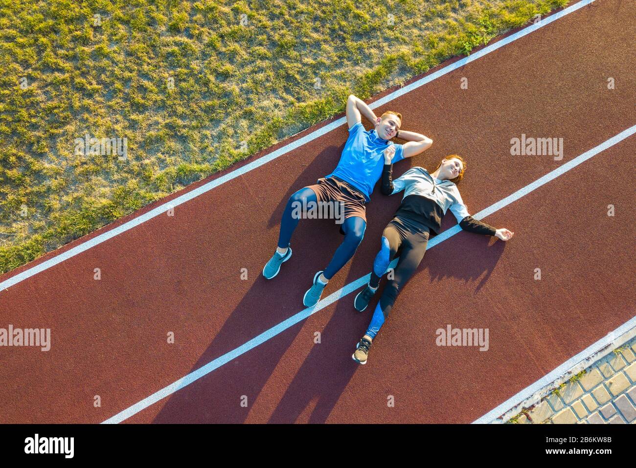 Top down aerial view of two young people sportsman and sportswoman ...