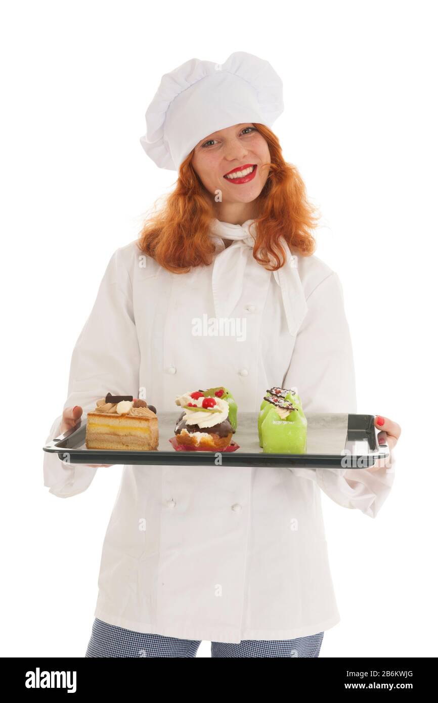 Female baker chef with red hair baked Christmas pastries isolated over ...