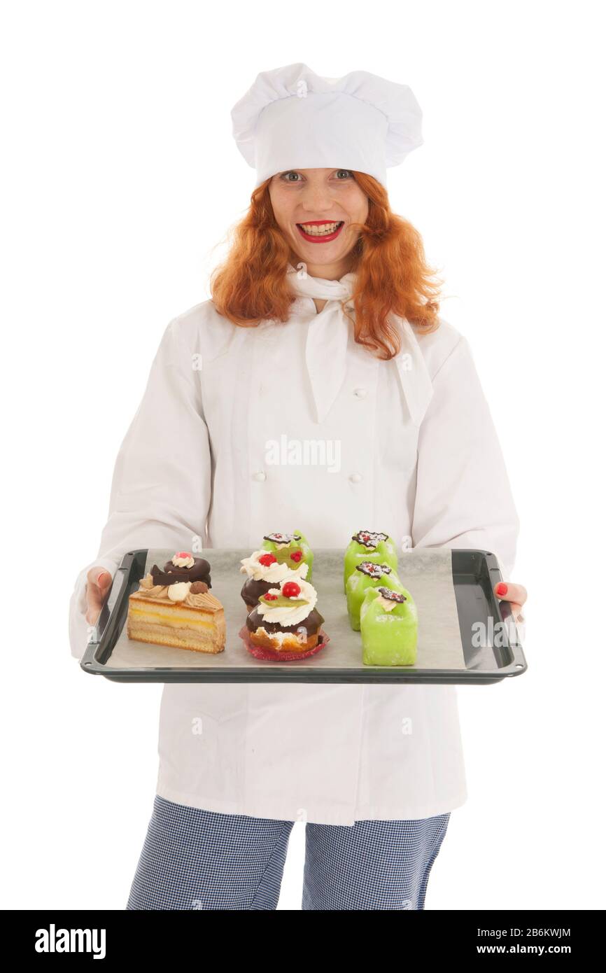 Female baker chef with red hair baked Christmas pastries isolated over ...