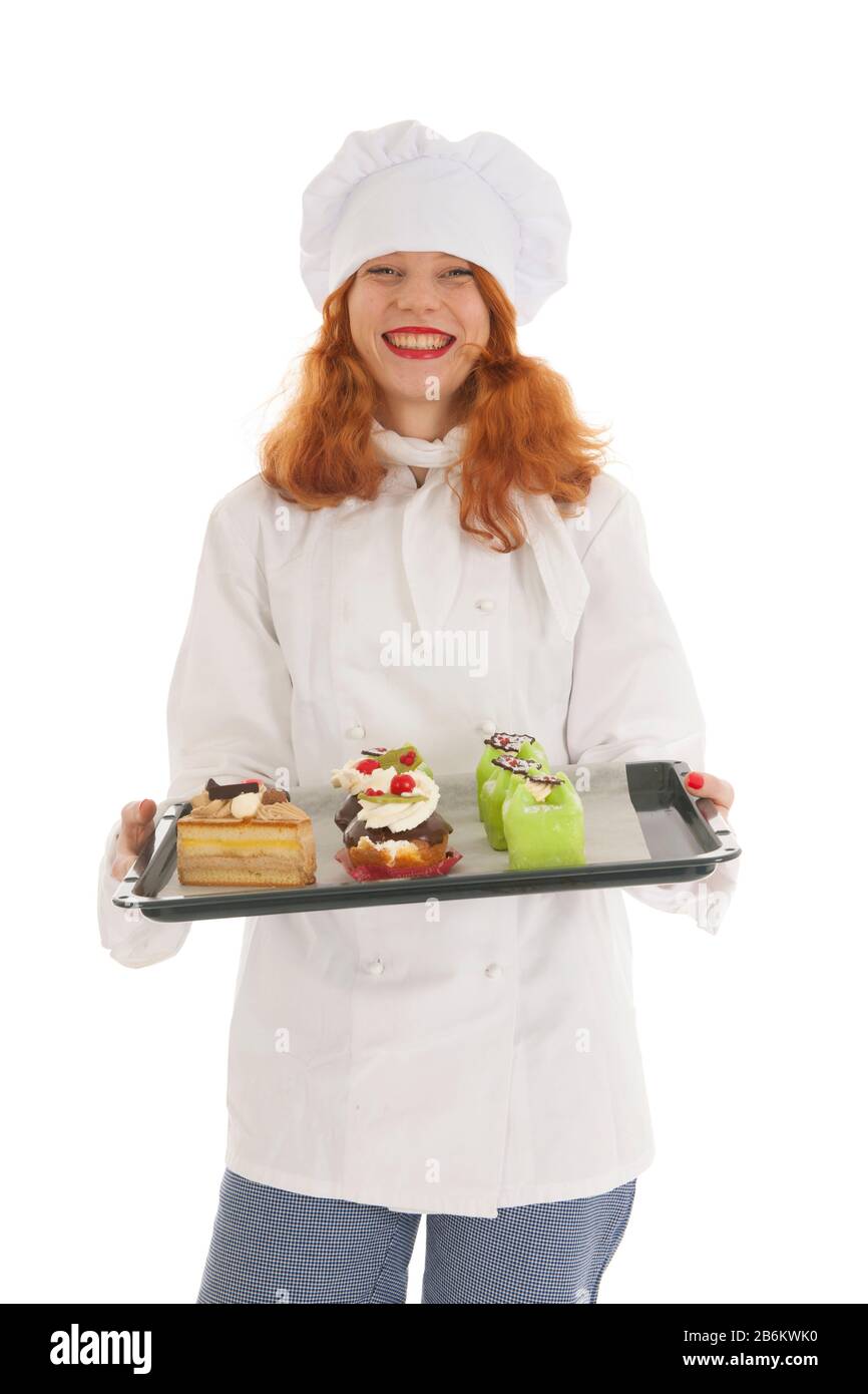Female baker chef with red hair baked Christmas pastries isolated over ...