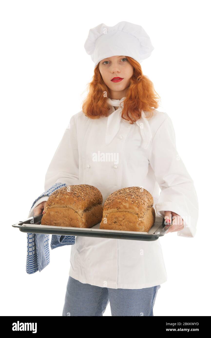 Female baker chef with red hair and baked bread isolated over white ...