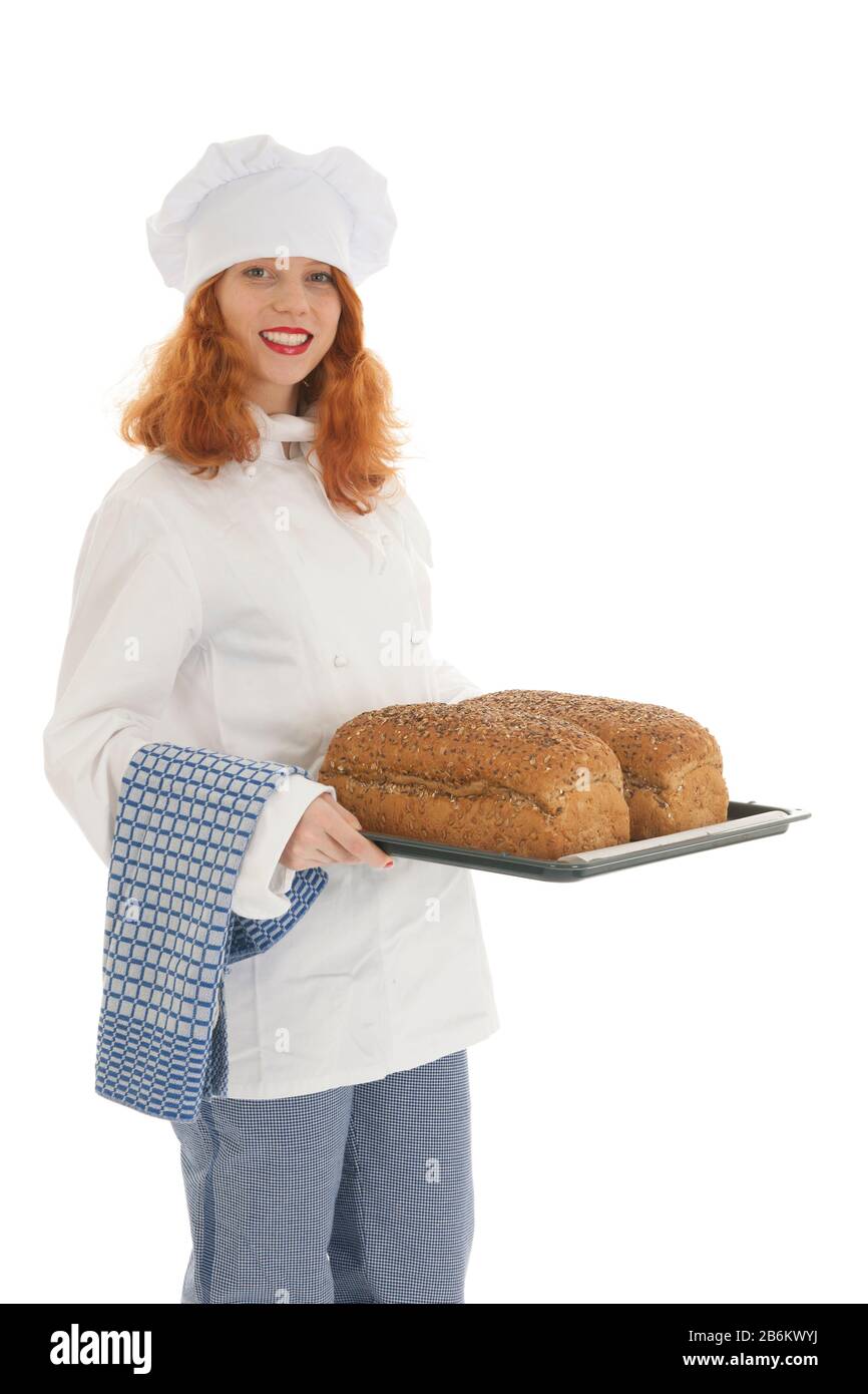 Female baker chef with red hair and baked bread isolated over white ...
