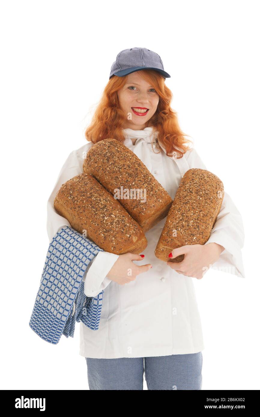 Female baker chef with red hair and baked bread isolated over white ...