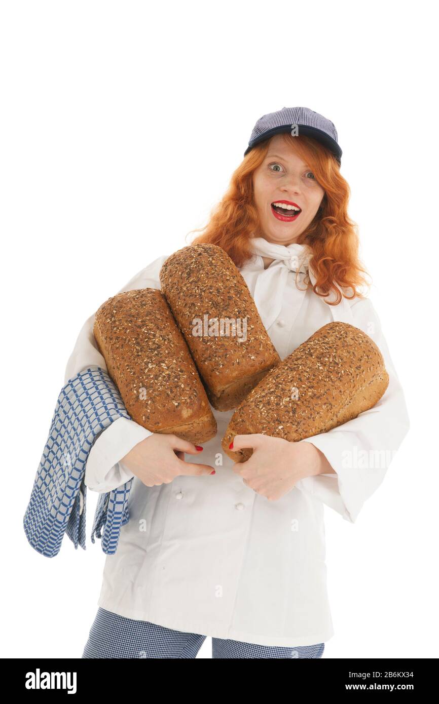 Female baker chef with red hair and baked bread isolated over white ...