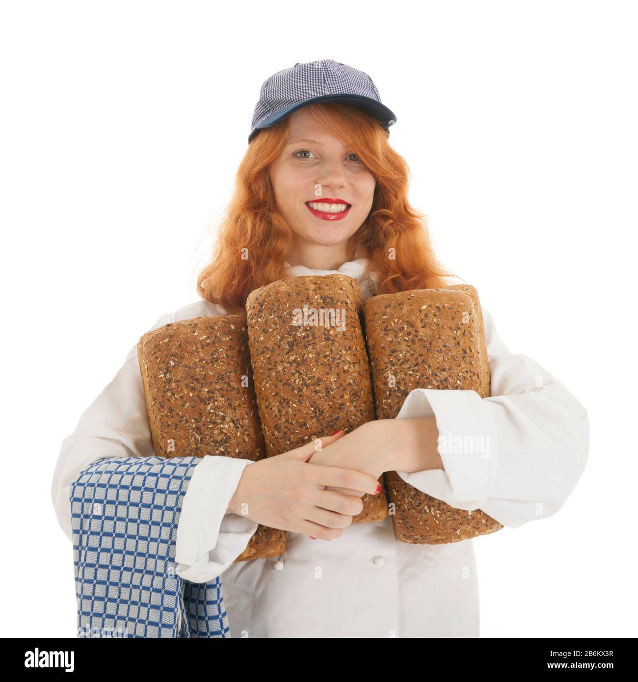 Female baker chef with red hair and baked bread isolated over white ...