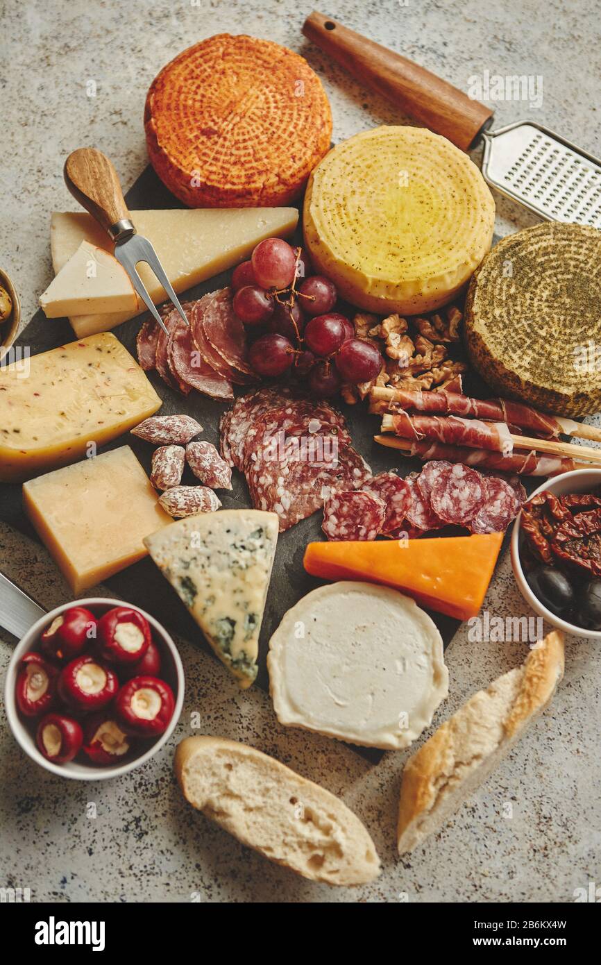 Delicious mix of different snacks and appetizers Stock Photo - Alamy