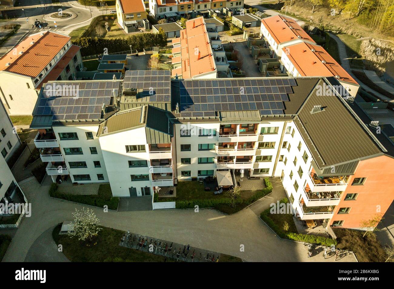 Aerial view of solar photovoltaic panels on a roof top of residential ...