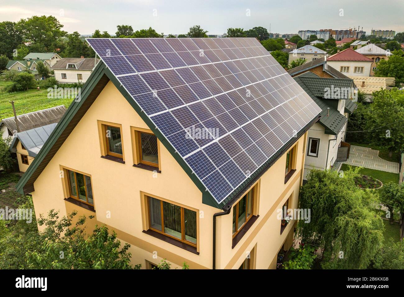 Aerial top view of new modern residential house cottage with blue shiny ...