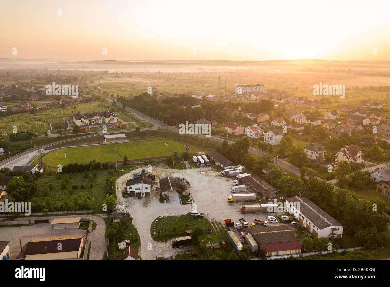Aerial landscape of small town or village with rows of residential ...