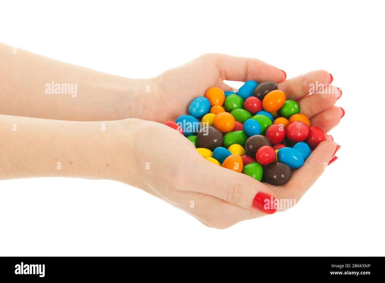 woman with colorful candy in hands Stock Photo - Alamy