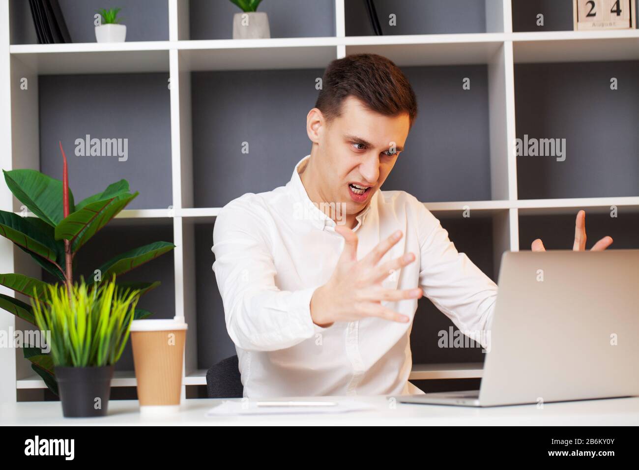 Tired man working at the computer in the office Stock Photo - Alamy