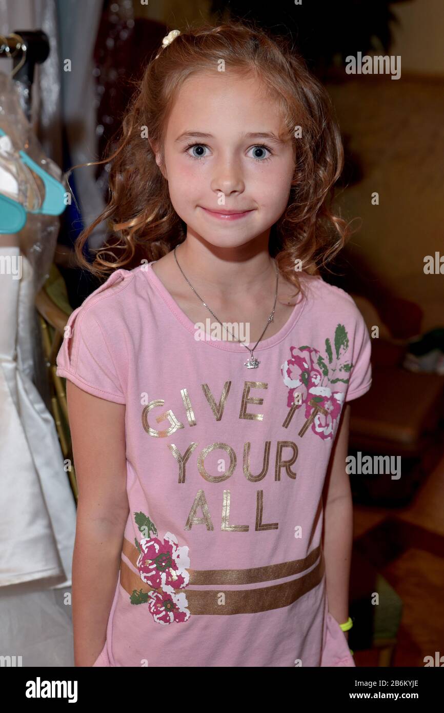 mMODEL WEARING SOLID PURPLE DRESS Stock Photo - Alamy