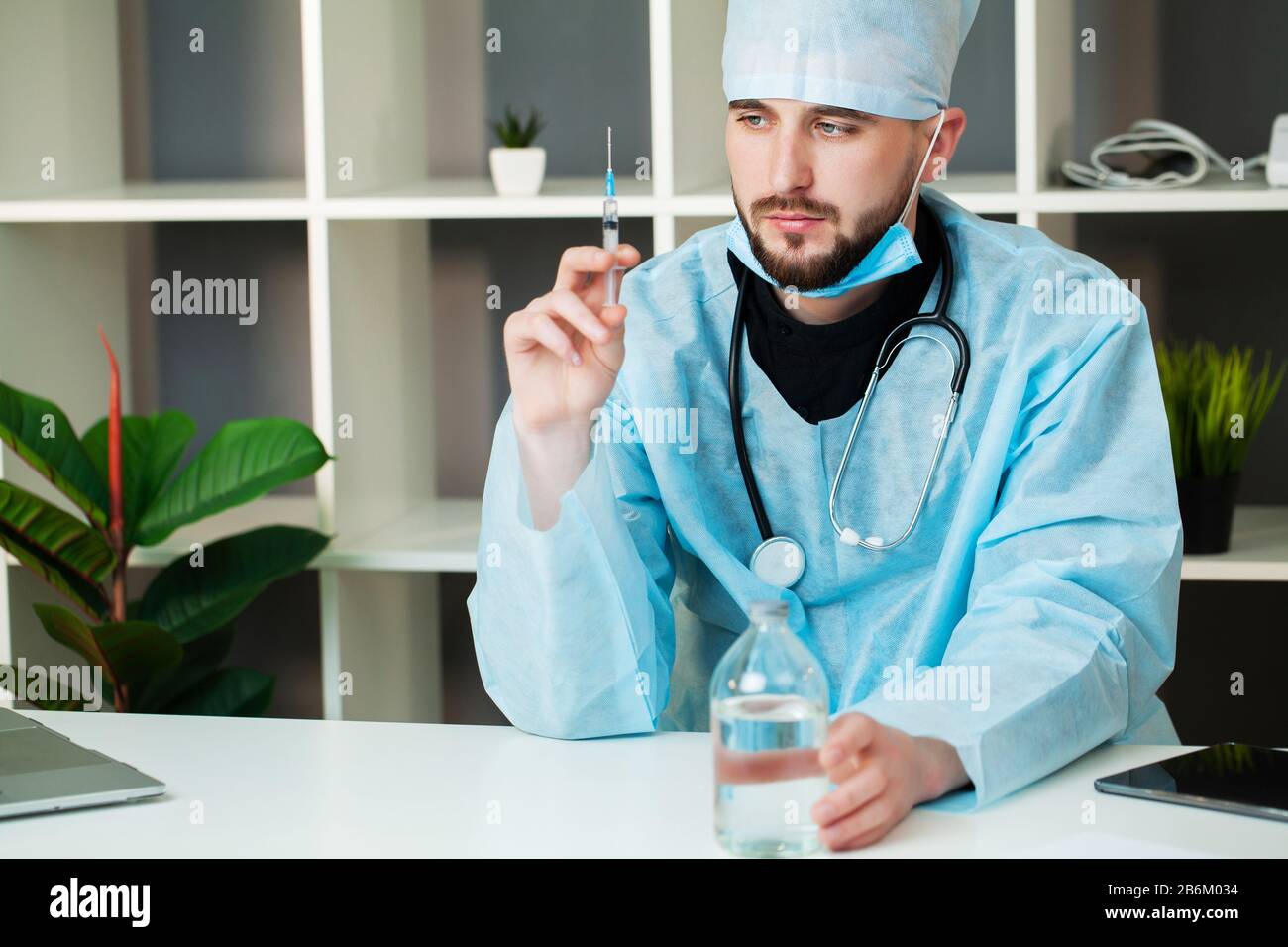The doctor comes into a solution for injection in a syringe Stock Photo ...