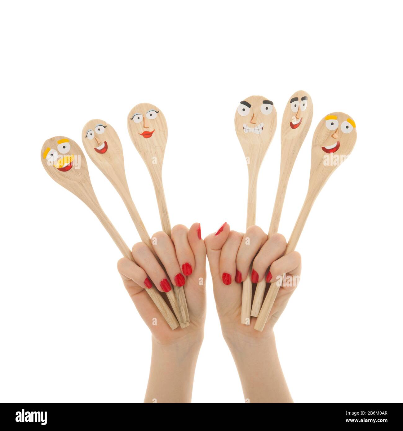 Funny wooden spoons in hands isolated over white background Stock Photo ...