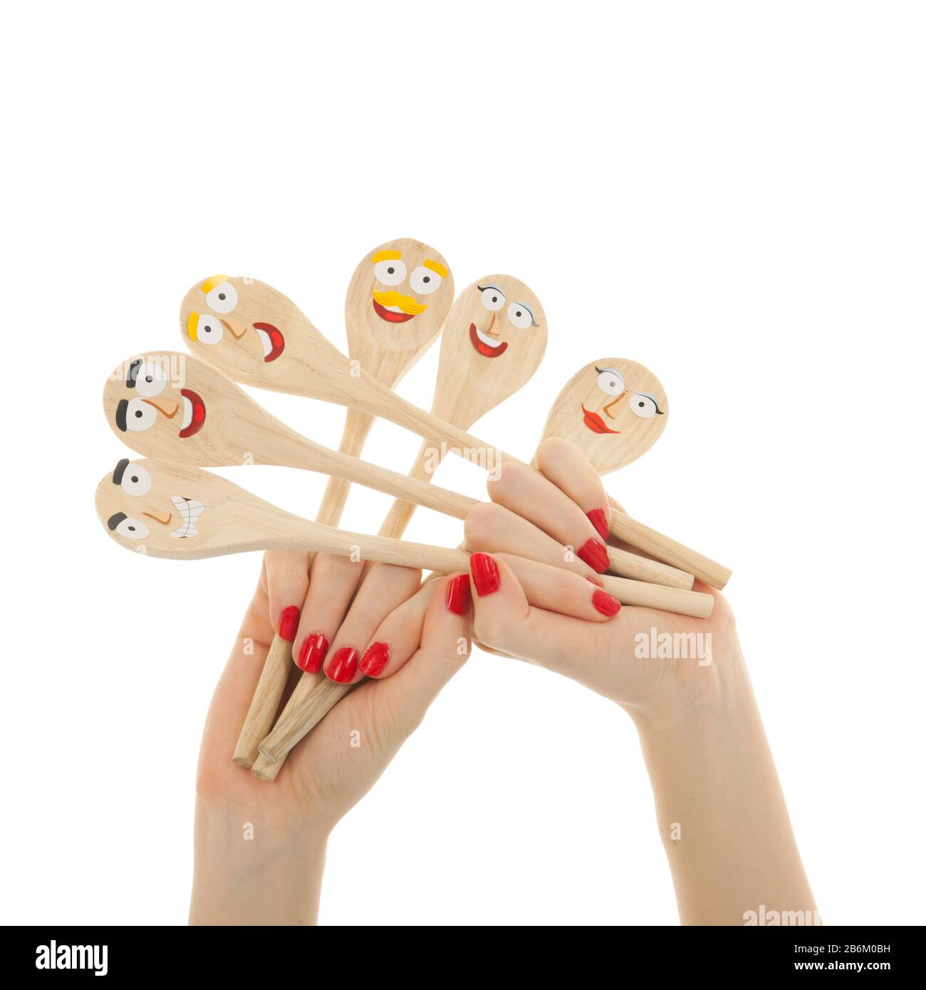 Funny wooden spoons in hands isolated over white background Stock Photo ...