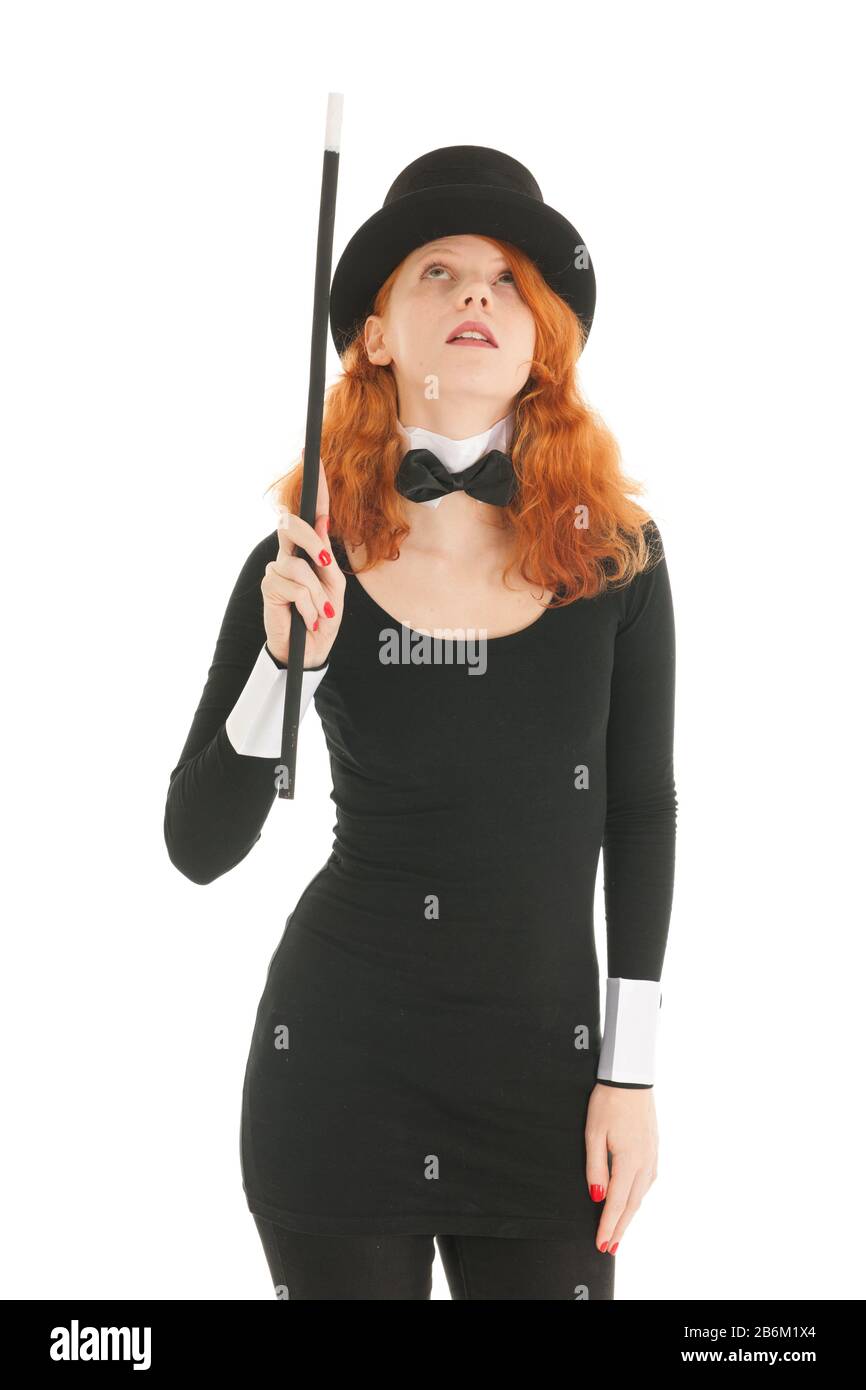 Woman as dandy with black hat pointing up with stick isolated over ...