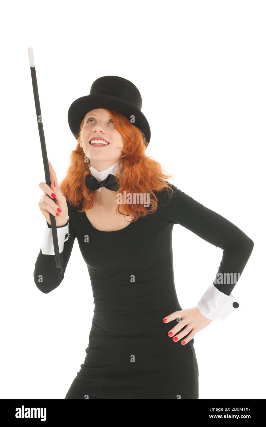 Woman as dandy with black hat pointing up with stick isolated over ...