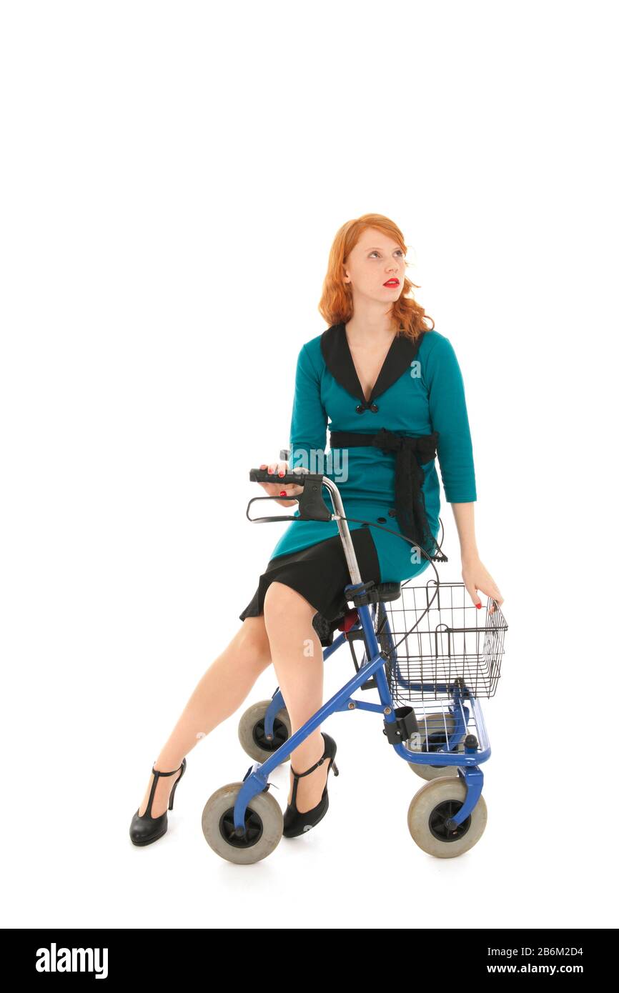 Disabled young woman sitting on walker Stock Photo - Alamy
