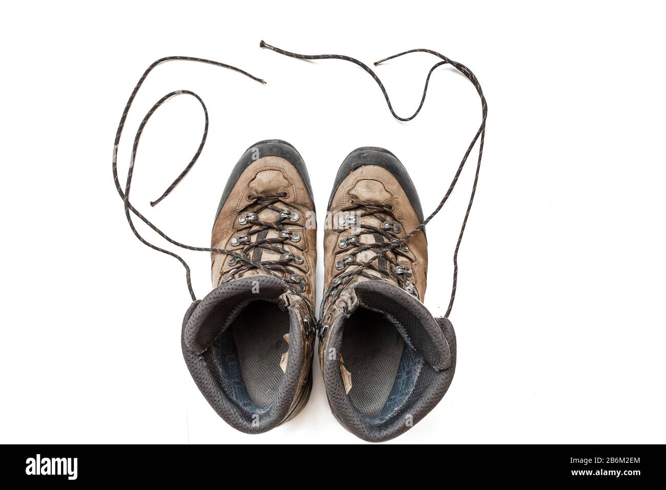 Old scuffed hiking boots isolated with laces on white background Stock ...