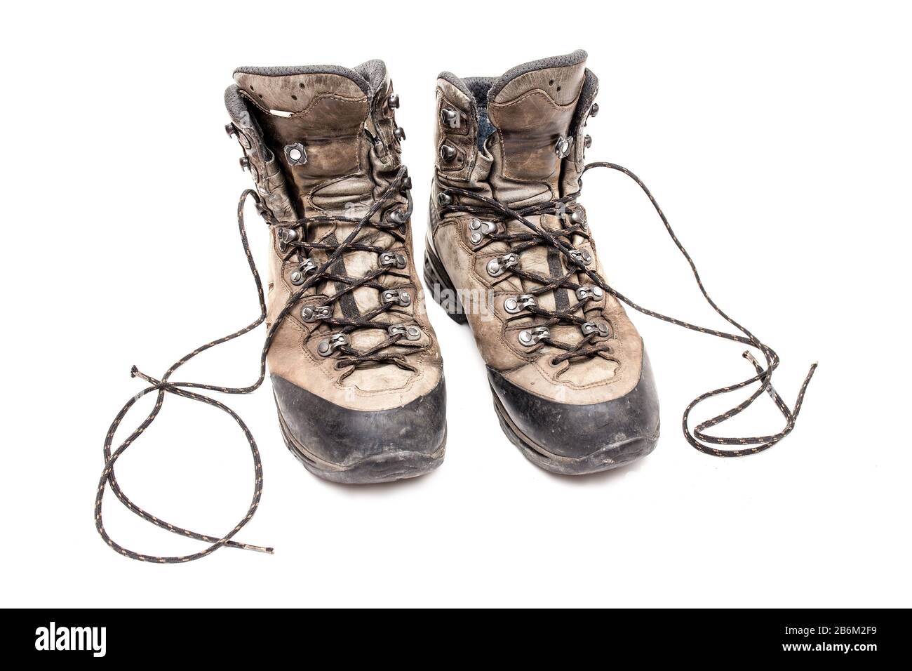 Old scuffed hiking boots isolated with laces on white background Stock ...