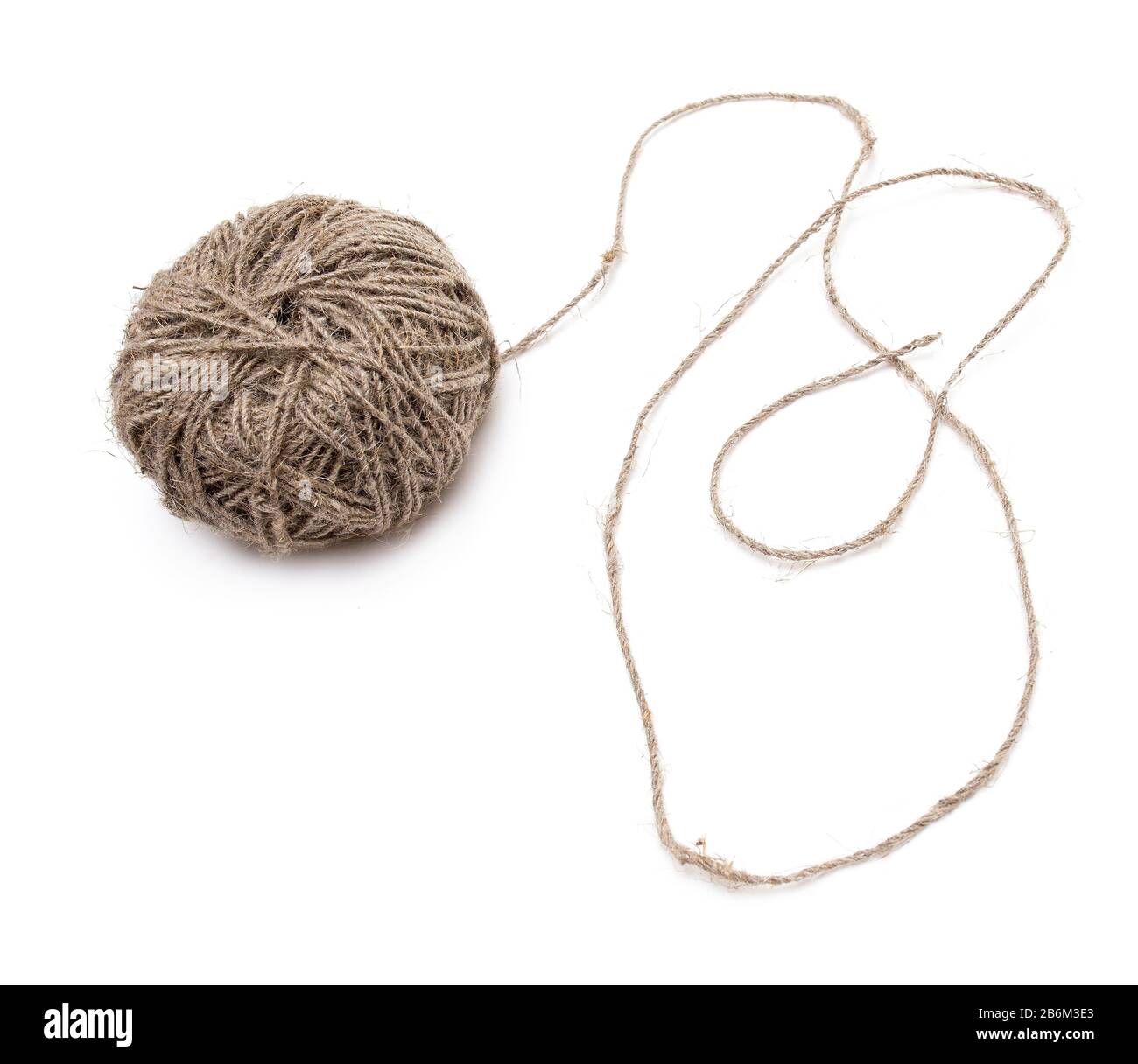 A tangled ball of hemp cord isolated Stock Photo - Alamy