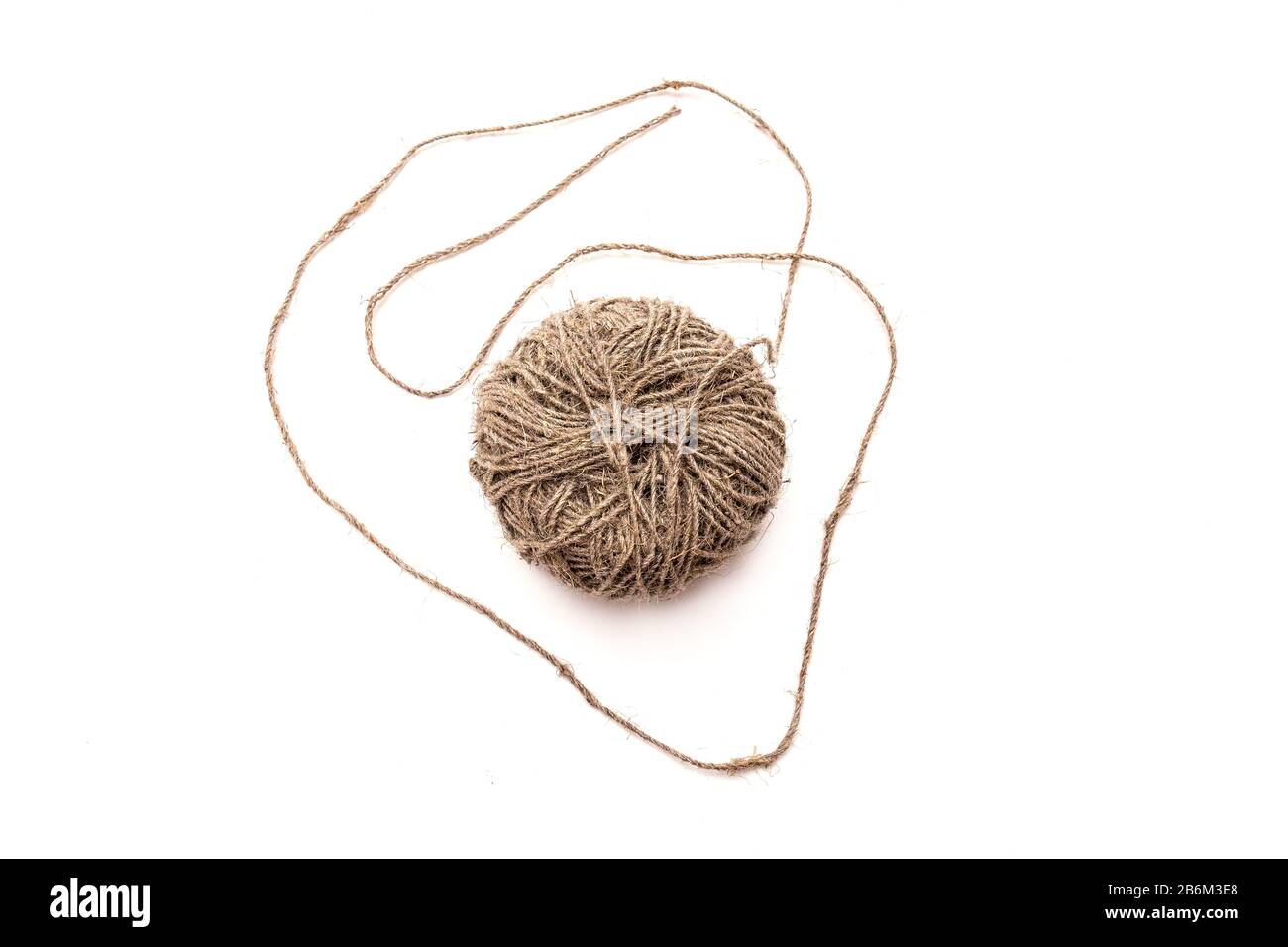 A tangled ball of hemp cord isolated Stock Photo - Alamy