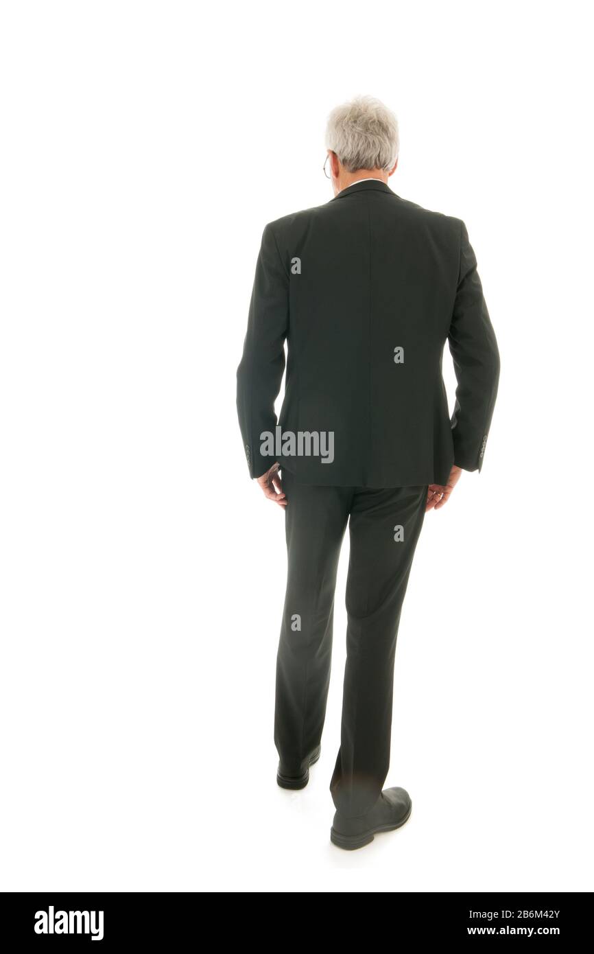 Senior business man walking away Stock Photo - Alamy